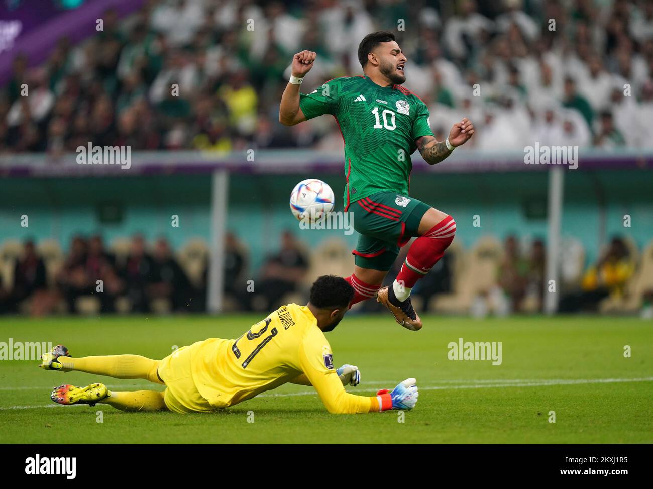 Saudi Arabia goalkeeper Mohammed Al-Owais saves a save to deny Mexico's ...