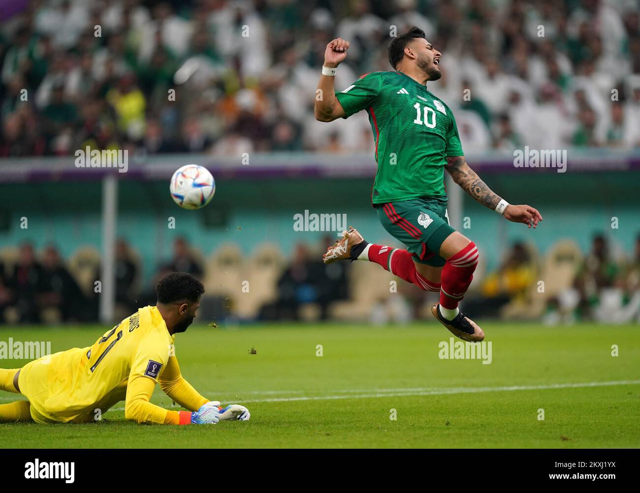 Saudi Arabia goalkeeper Mohammed Al-Owais saves a save to deny Mexico's ...