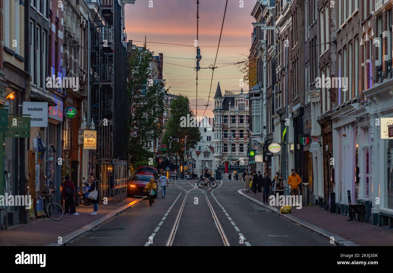 A picture of a street in Amsterdam at sunset Stock Photo - Alamy