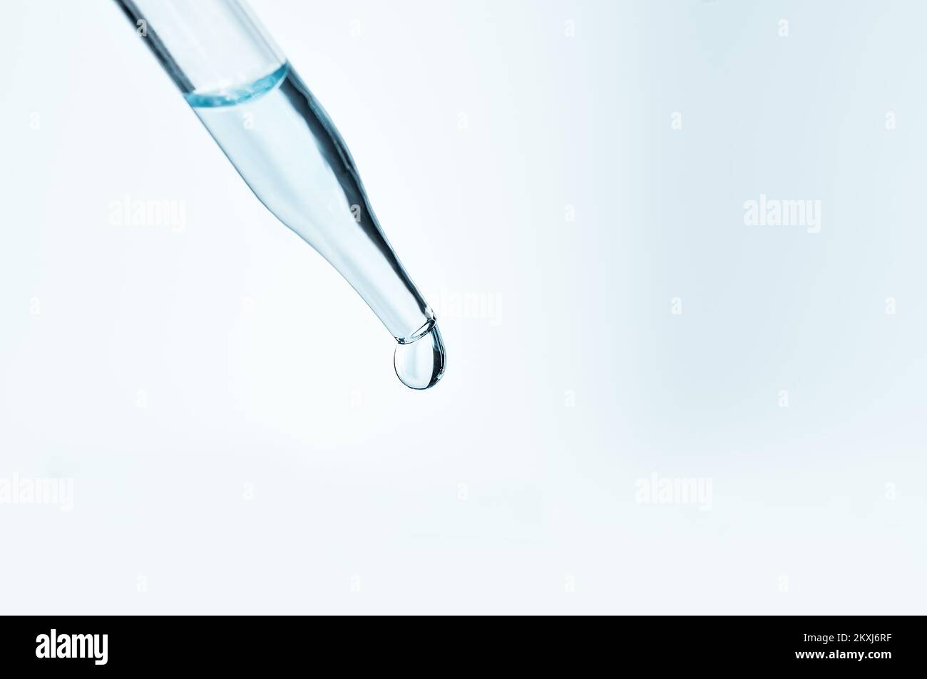 Glass pipette on white background with Serum in Dropper. science ...