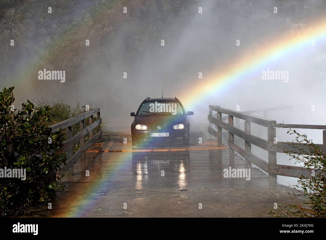 The car passes under the rainbow at Krcic Waterfall, in Knin, Croatia ...