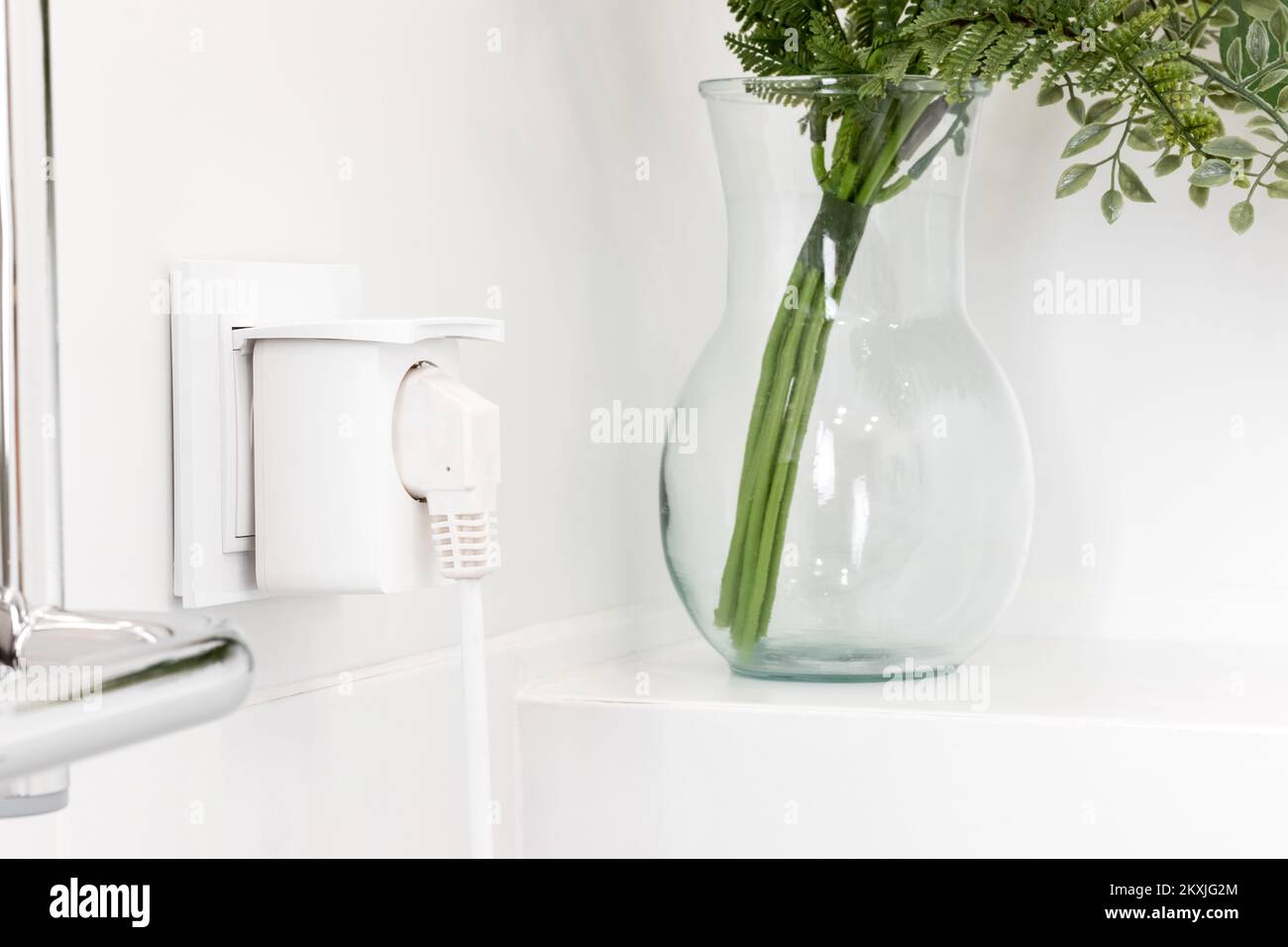 White european electrical outlet with smart plug inserted into it on ...