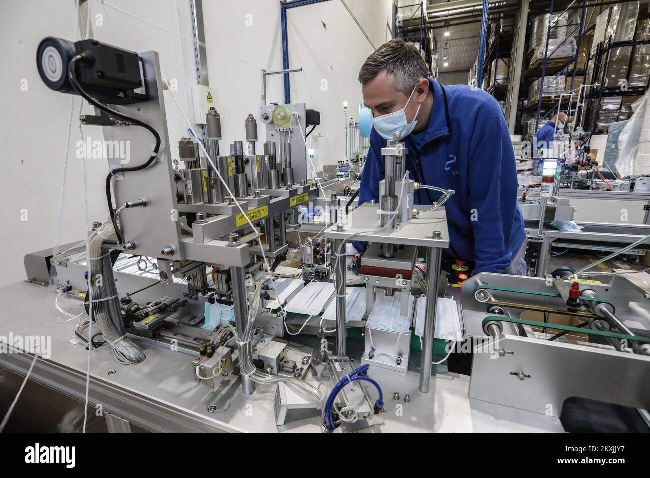 Factory worker oversees production of surgical masks, in Zagreb ...