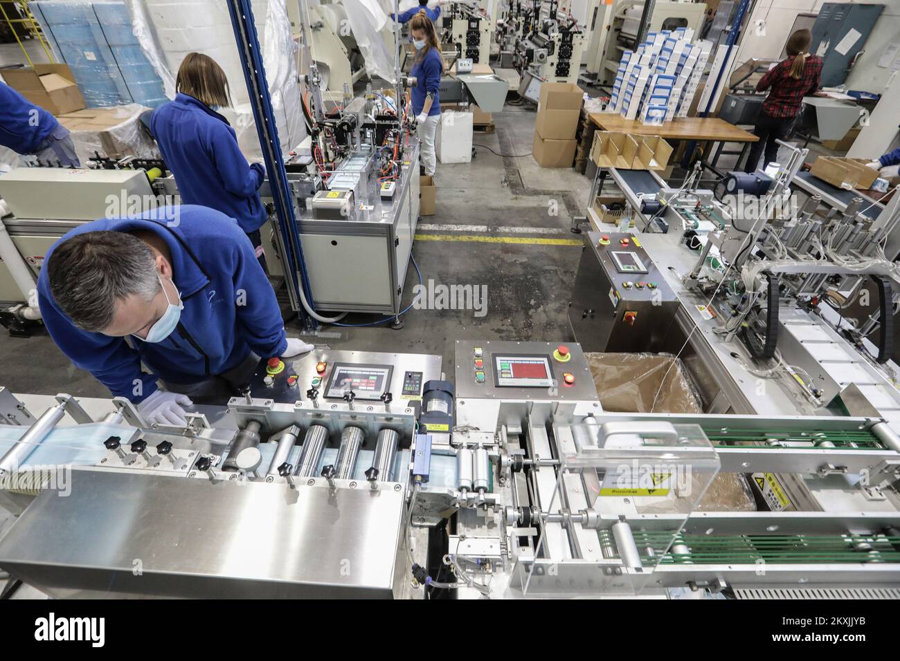 Factory worker oversees production of surgical masks, in Zagreb ...