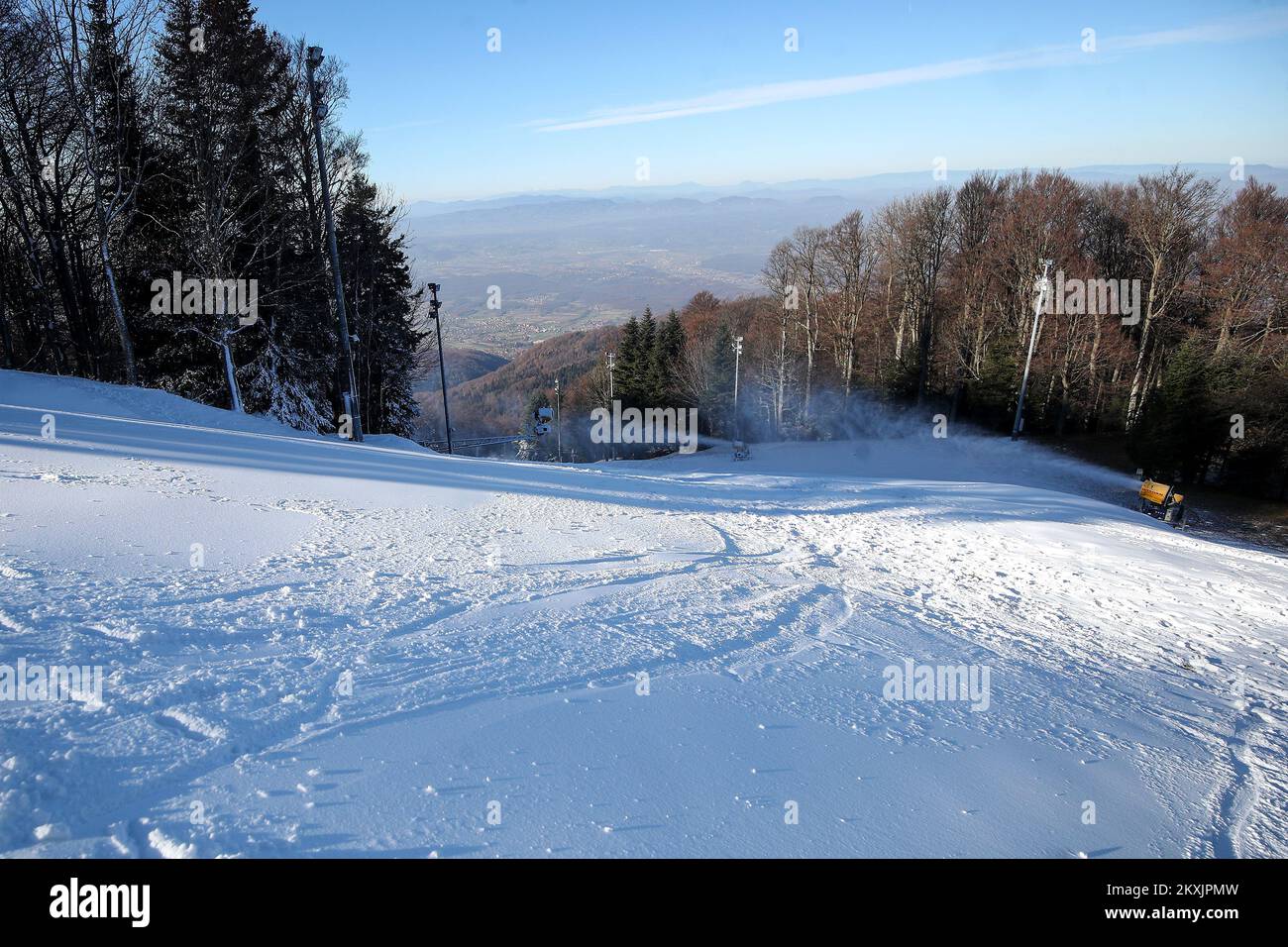 A snowmaking machine works at Red slope on Mount Medvednica in Zagreb ...