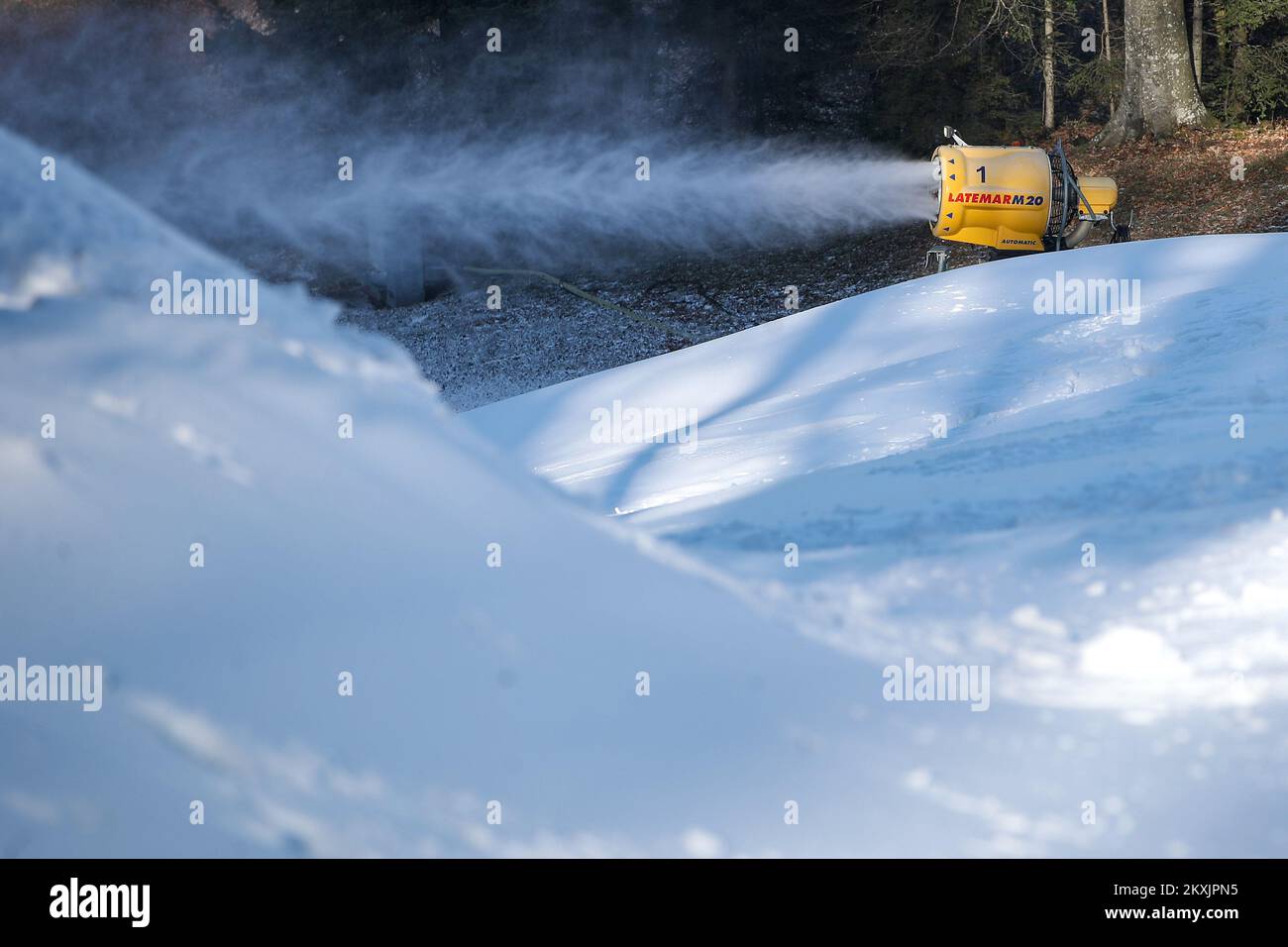 A snowmaking machine works at Red slope on Mount Medvednica in Zagreb ...