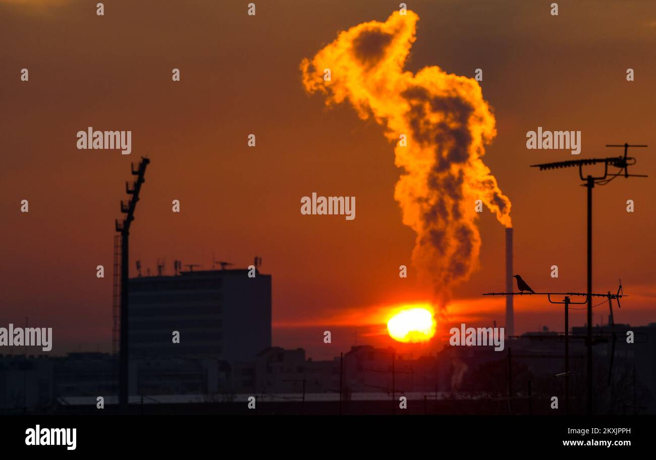 Sunrise in Zagreb, Croatia vith a view at smoke from power plant and ...