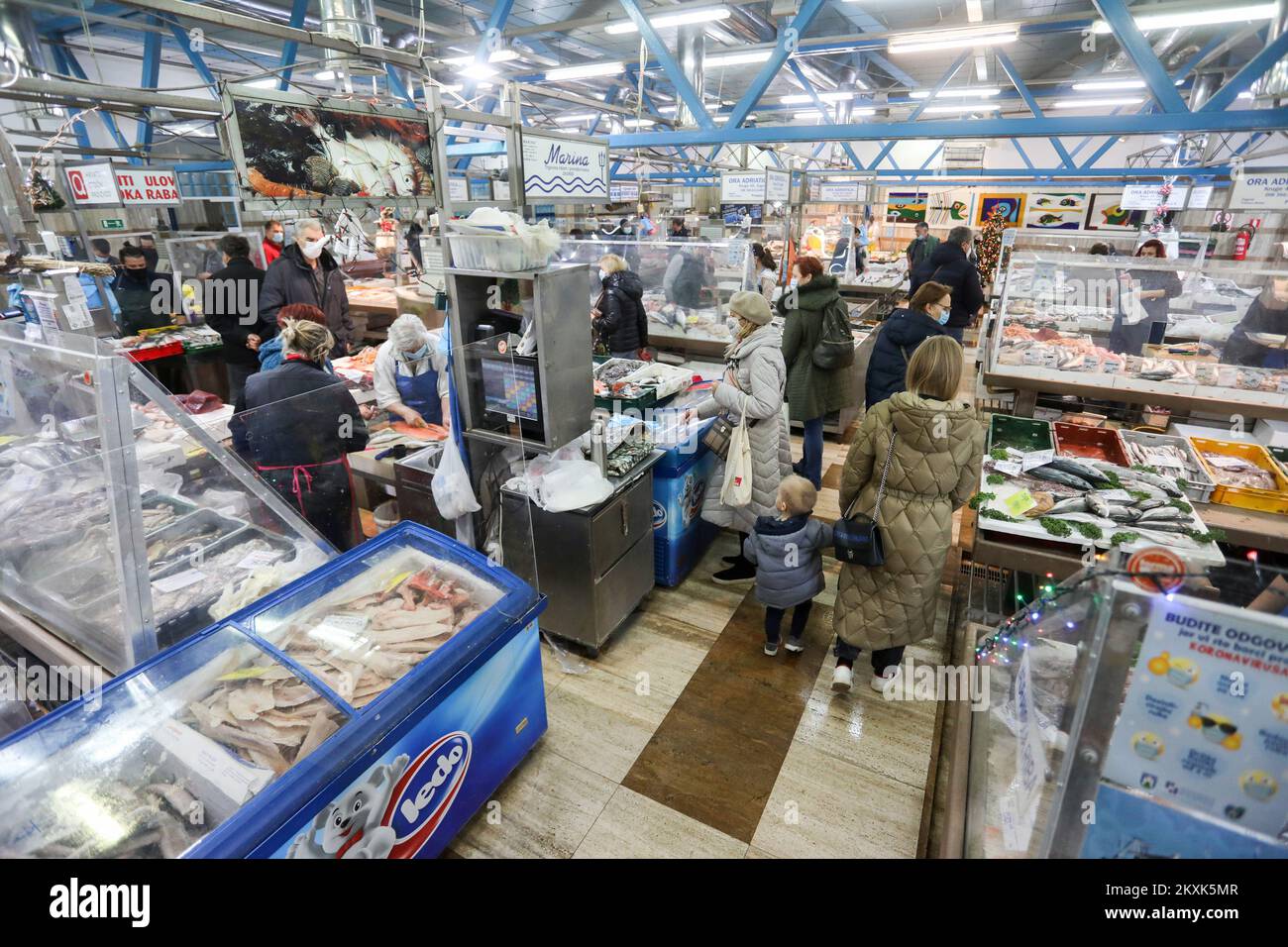 People buy fishes at a fish market Dolac on Christmas Eve in Zagreb ...