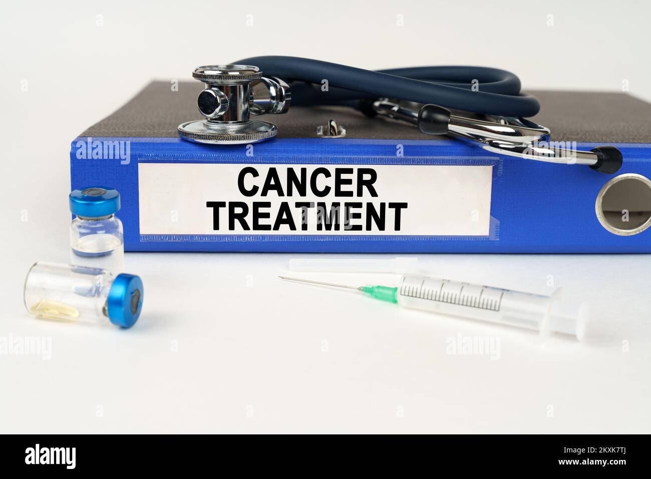 Medical concept. On a white surface, a syringe, a stethoscope and a ...