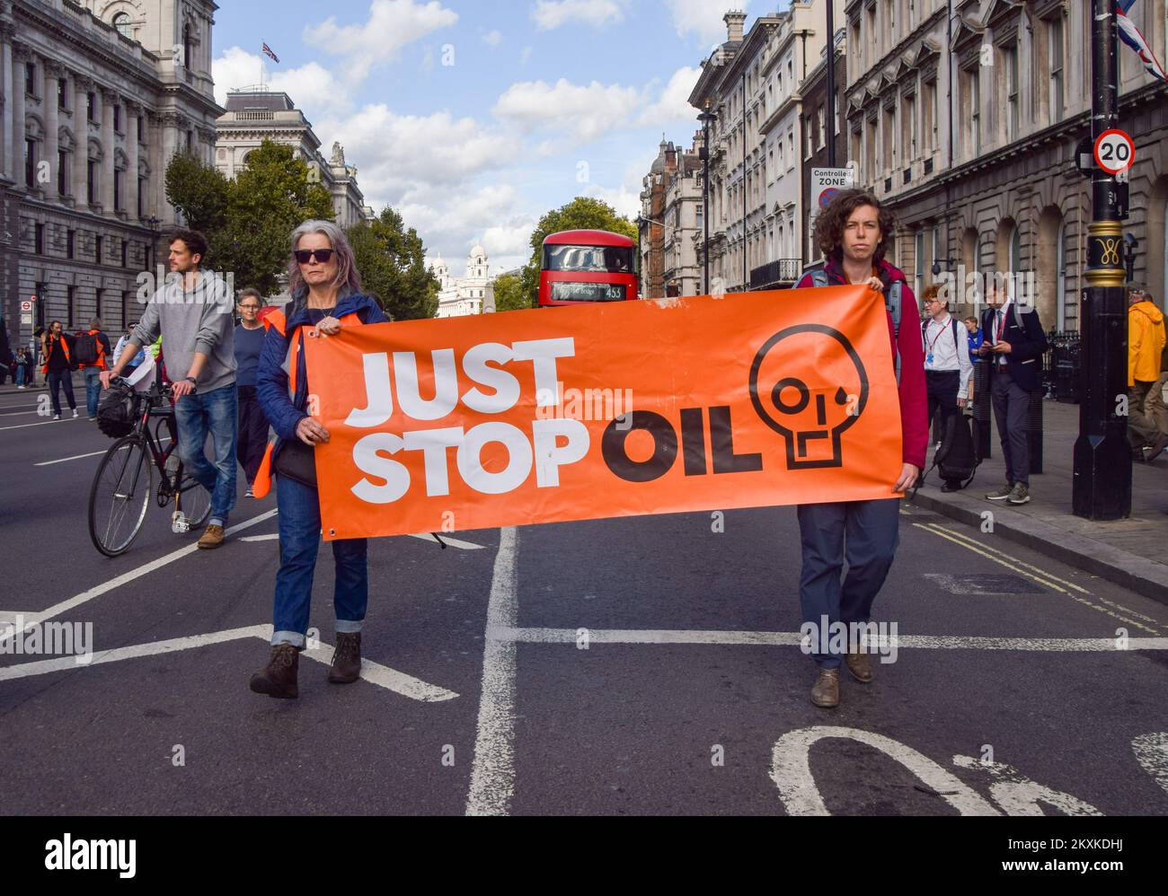 London, UK. 7th October 2022. Just Stop Oil activists march through ...