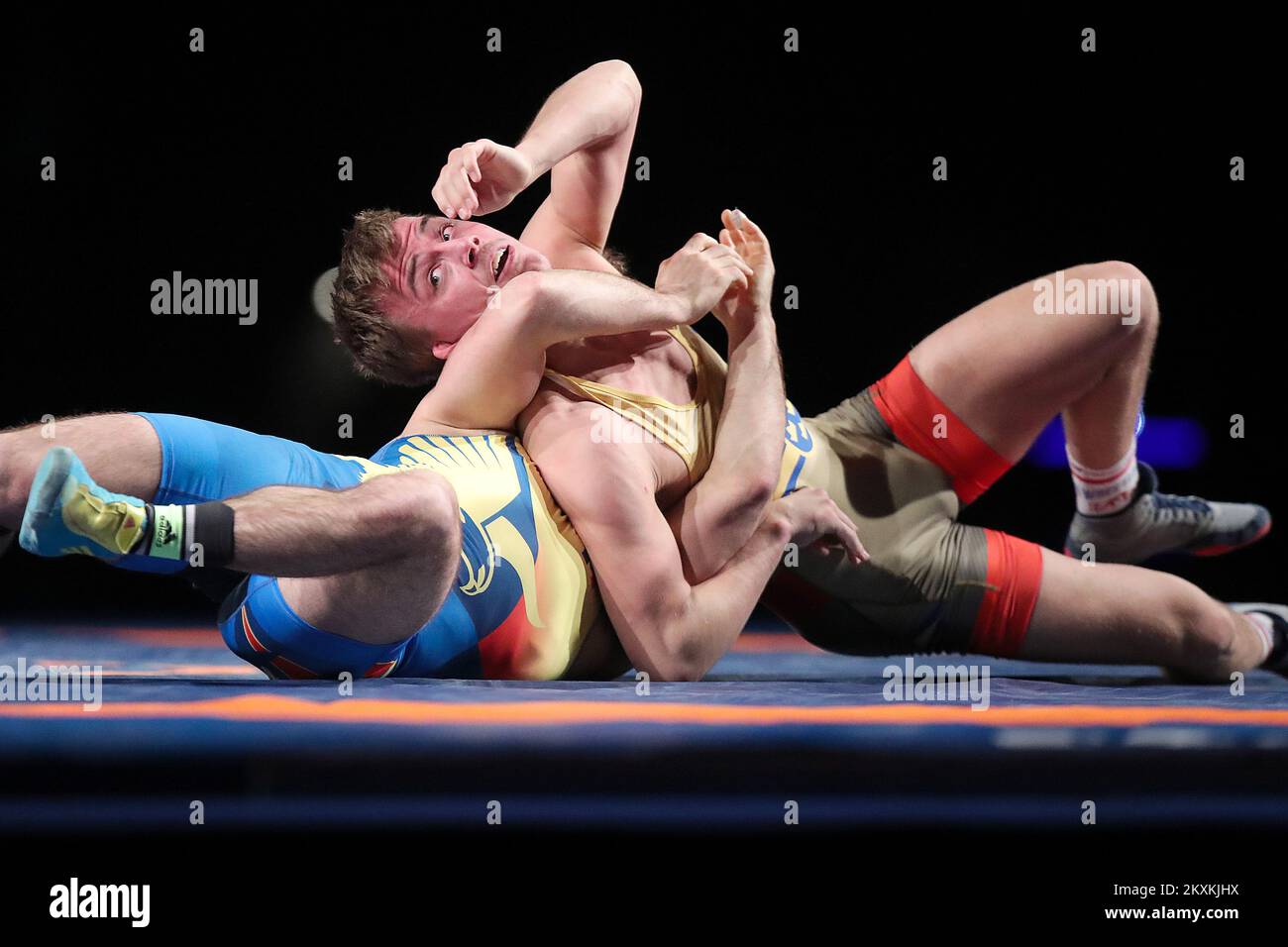Niklas Ohlen of Sweden (in red) fights with Victor Ciobanu of Moldova ...