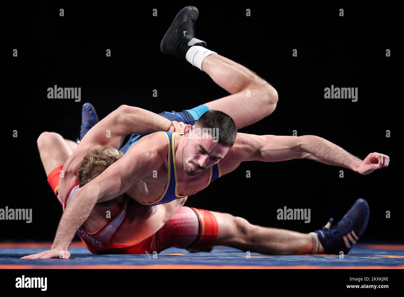 Hannes Wagner of Germany (in red) fights with Alex Kessidis of Sweden ...