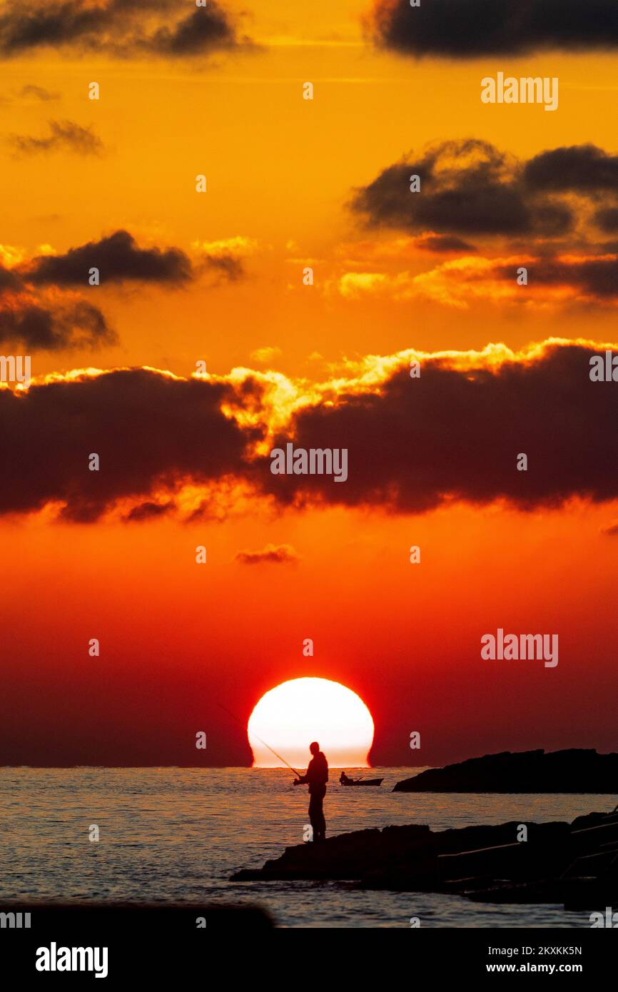 Sunset at the sea in front of Pula, Croatia on 10. January, 2021. Photo ...
