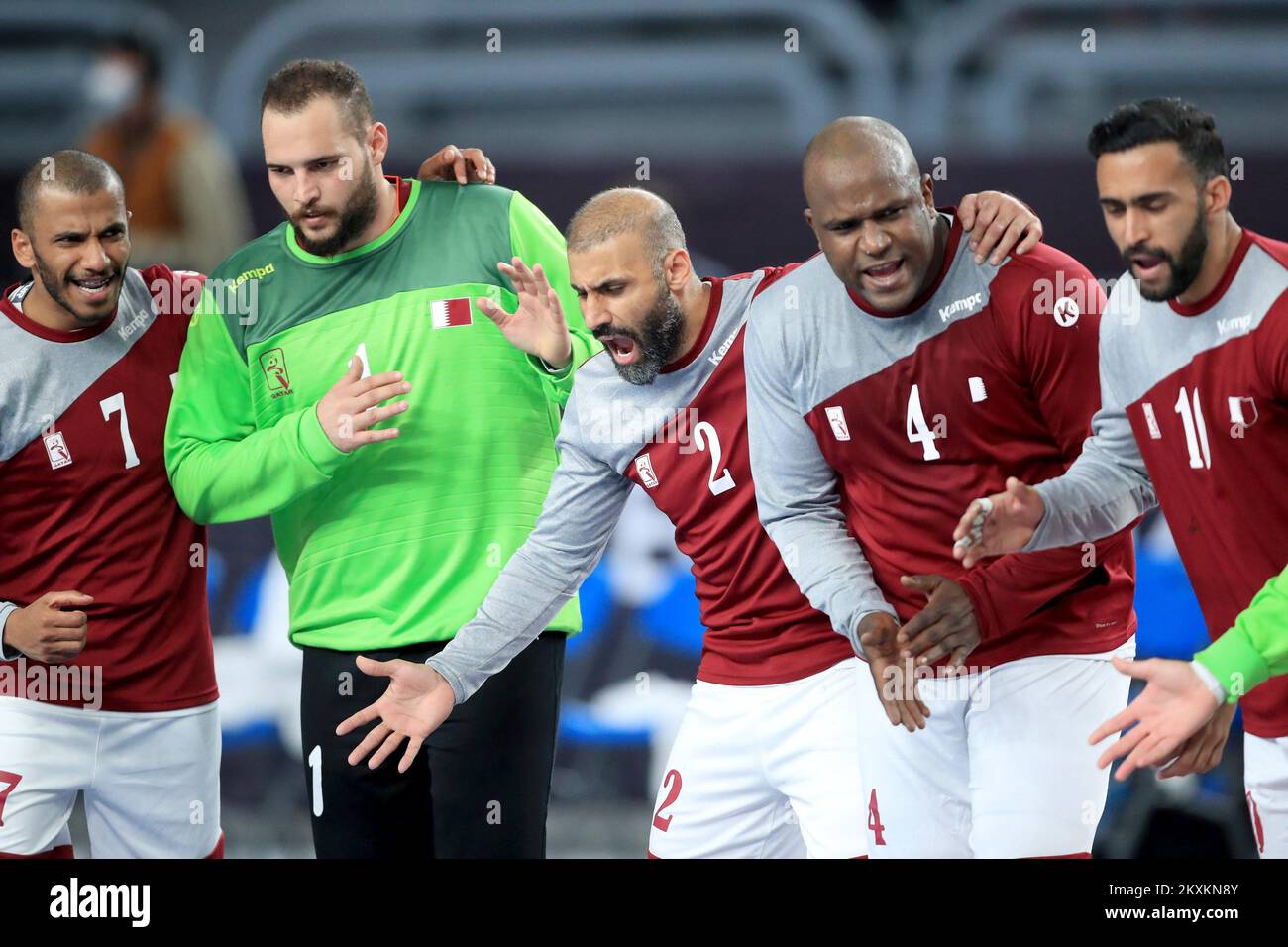 CAIRO, EGYPT - JANUARY 21: Qatar players listen national anthems prior ...