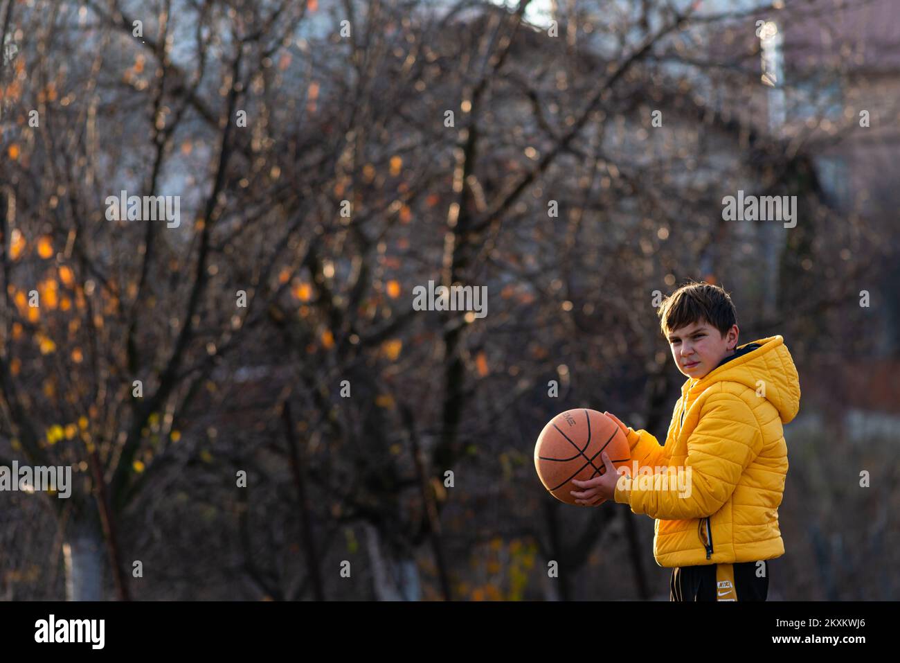 Young boy holding in hands Basketball sport Young little caucasian ...
