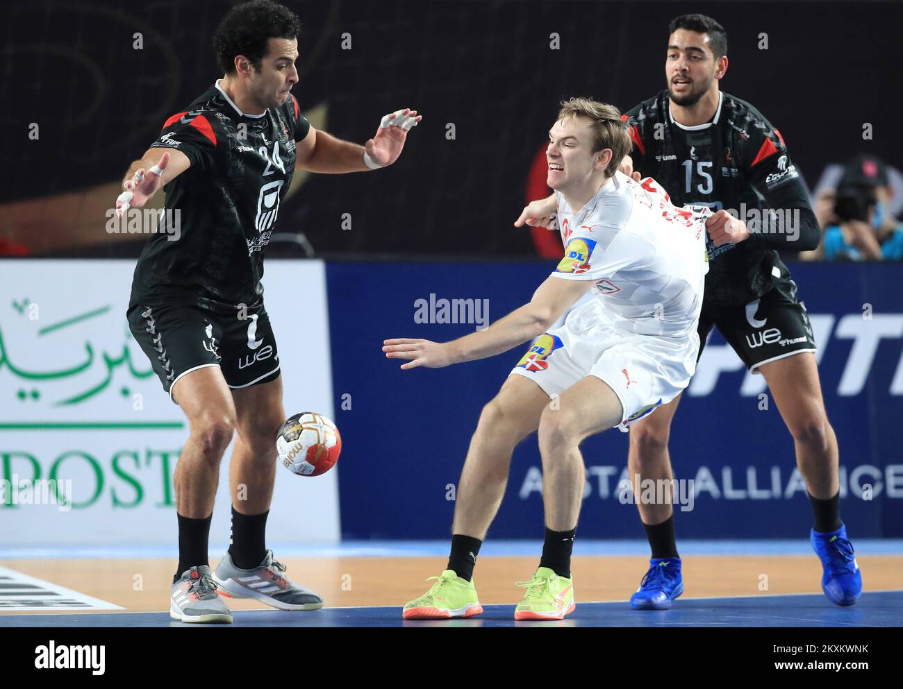 CAIRO, EGYPT - JANUARY 27: Mathias Gidsel of Denmark and Ibrahim El-Masry and Ahmed Hesham of ...