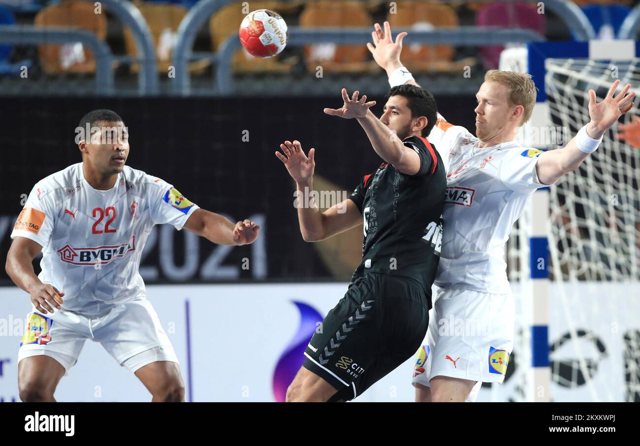 CAIRO, EGYPT - JANUARY 27: Yahia Omar of Egypt and Anders Zachariassen and Mads Mensah Larsen of ...