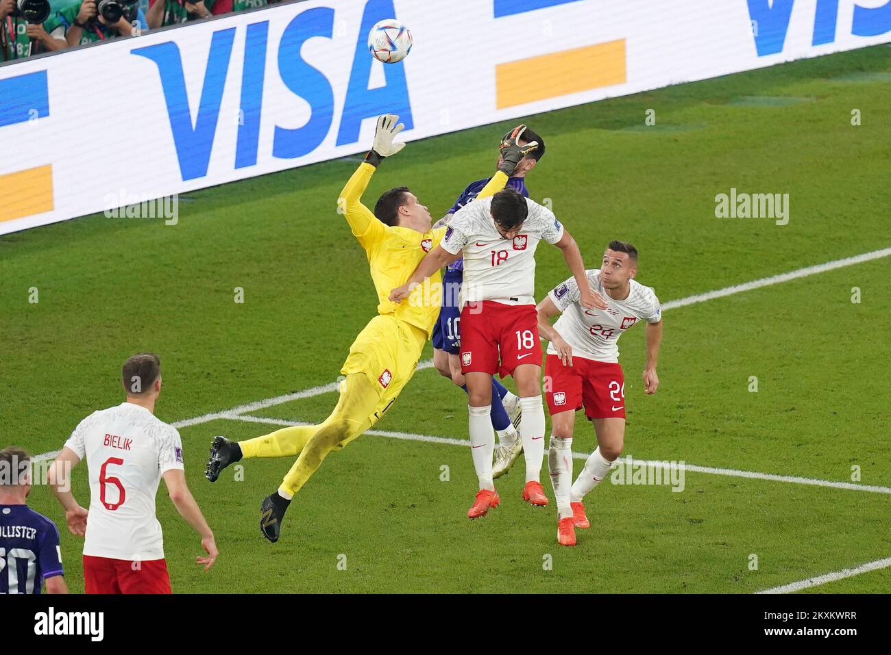 Argentina's Lionel Messi (hidden) is caught by Poland goalkeeper ...