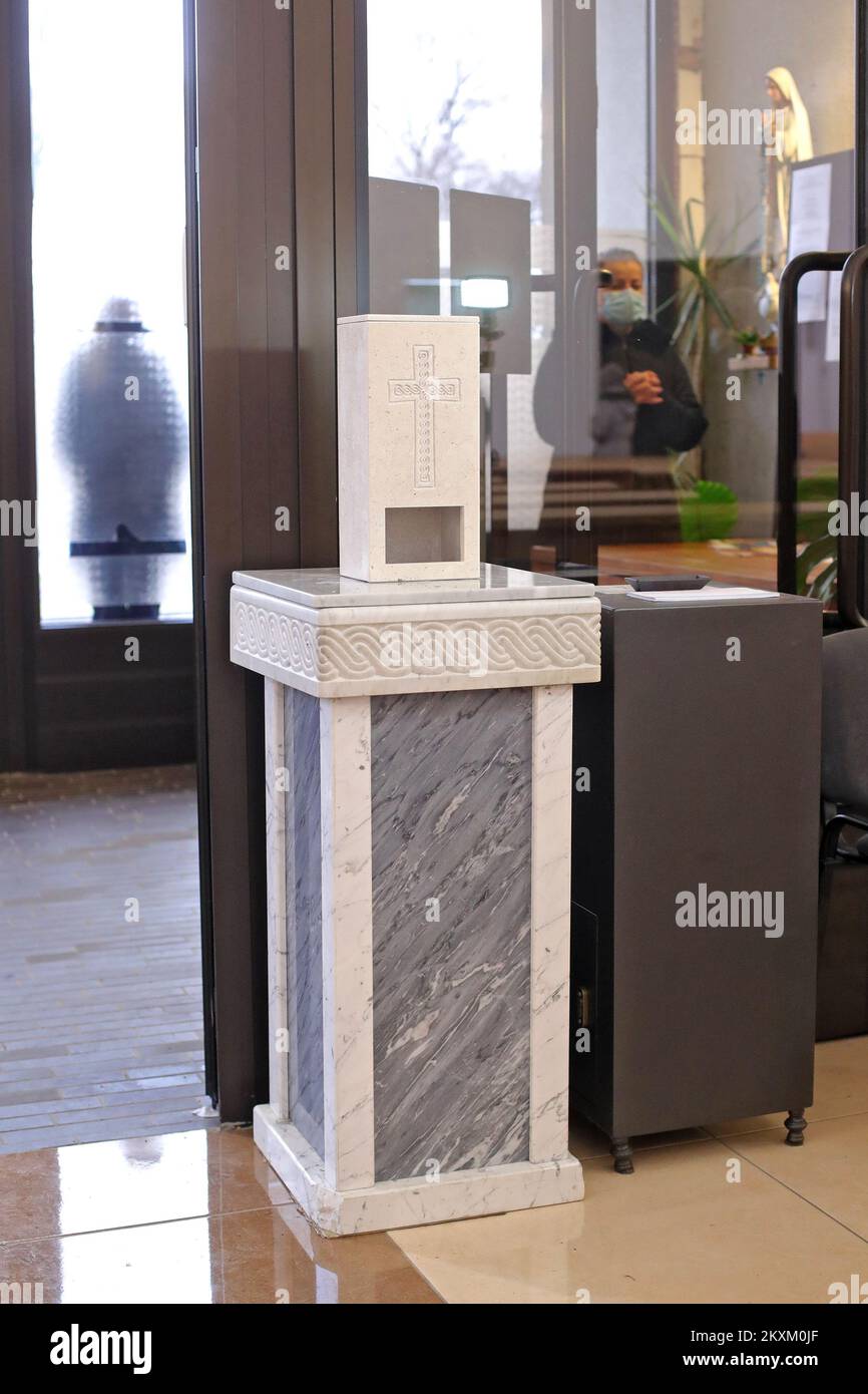 Holy water dispenser hi-res stock photography and images - Alamy