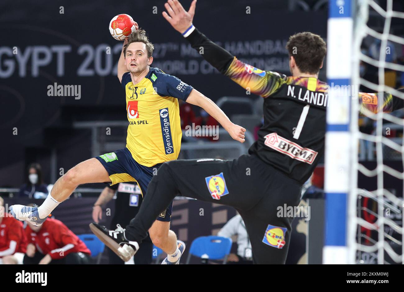 CAIRO, EGYPT - JANUARY 31: Hampus Wanne of Sweden and Niklas Landin Jacobsen of Denmark during ...