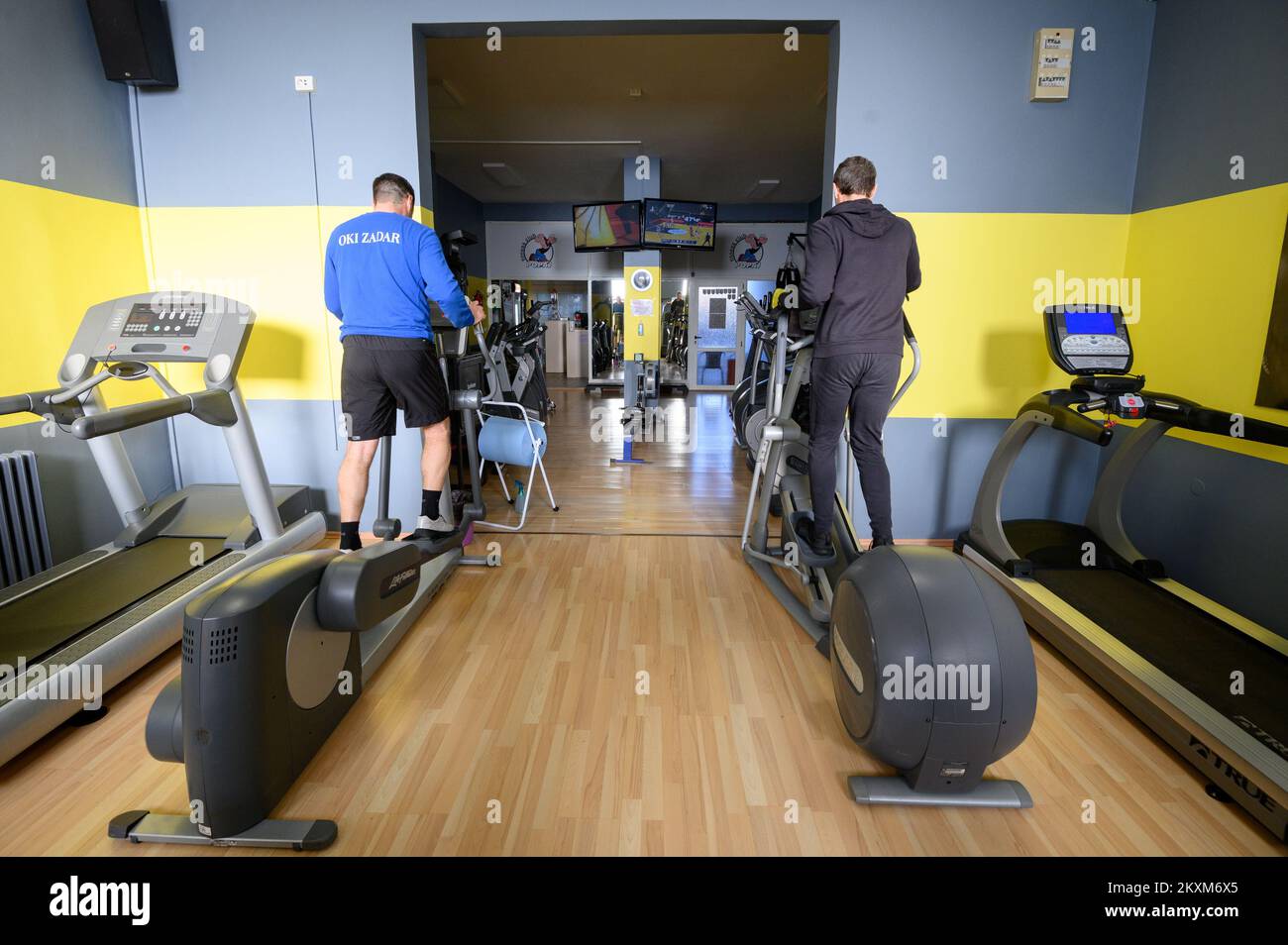 A man exercises in a gym as the coronavirus disease (COVID-19 ...