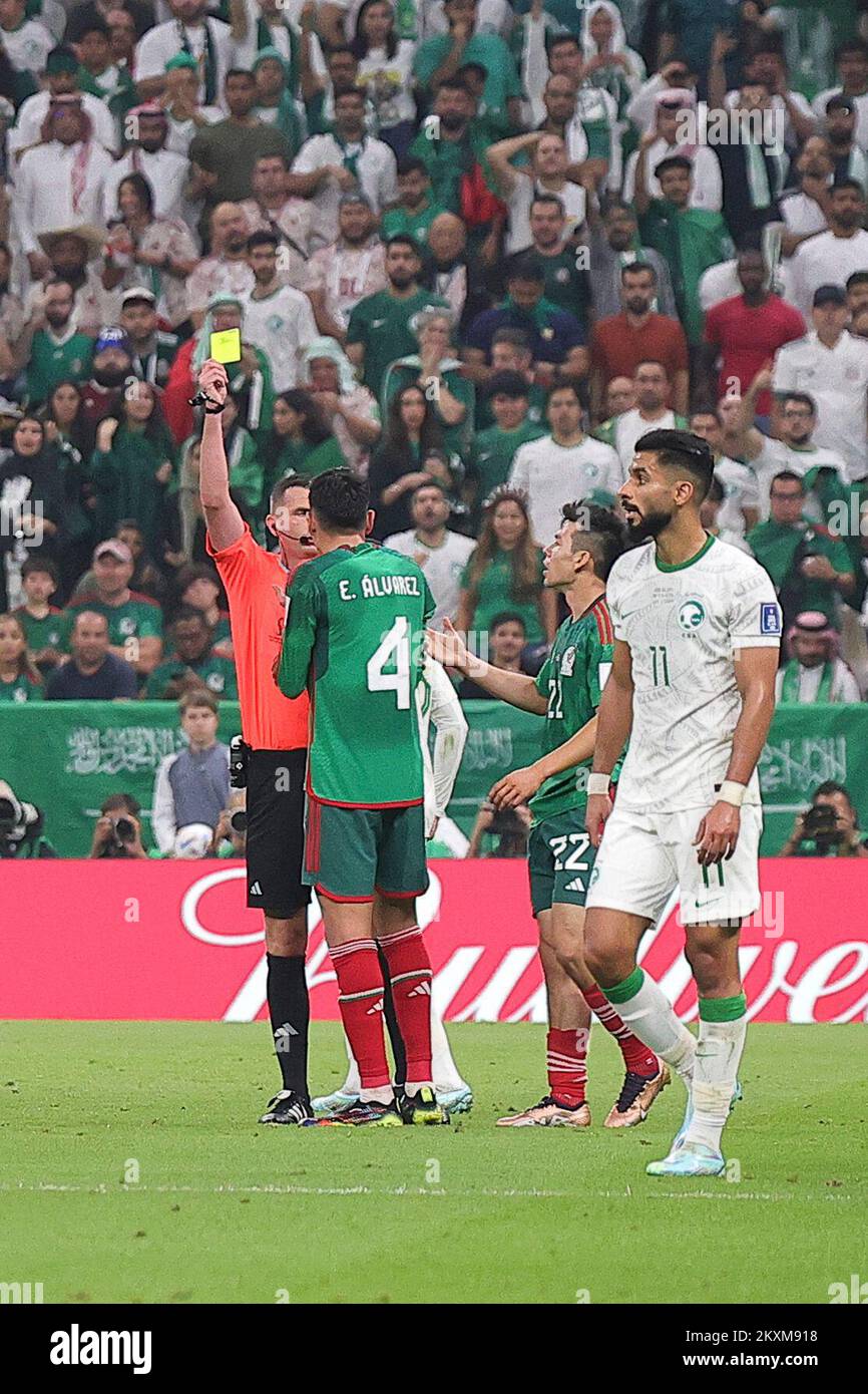 Lusail, Qatar. 30th Nov, 2022. Referee Michael Oliver (1st L) shows a ...