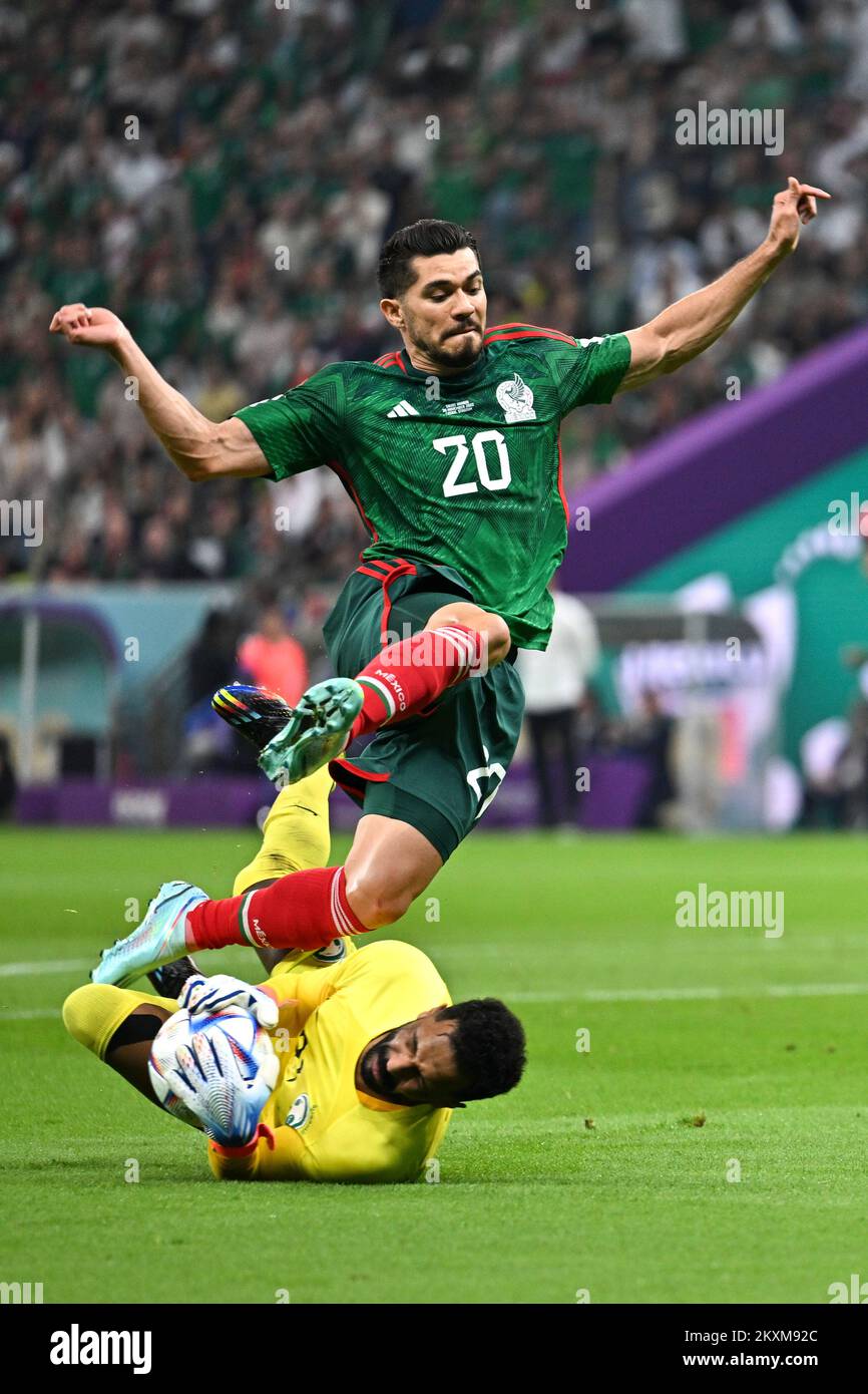 Lusail, Qatar. 30th Nov, 2022. Mohammed Alowais (below), goalkeeper of ...