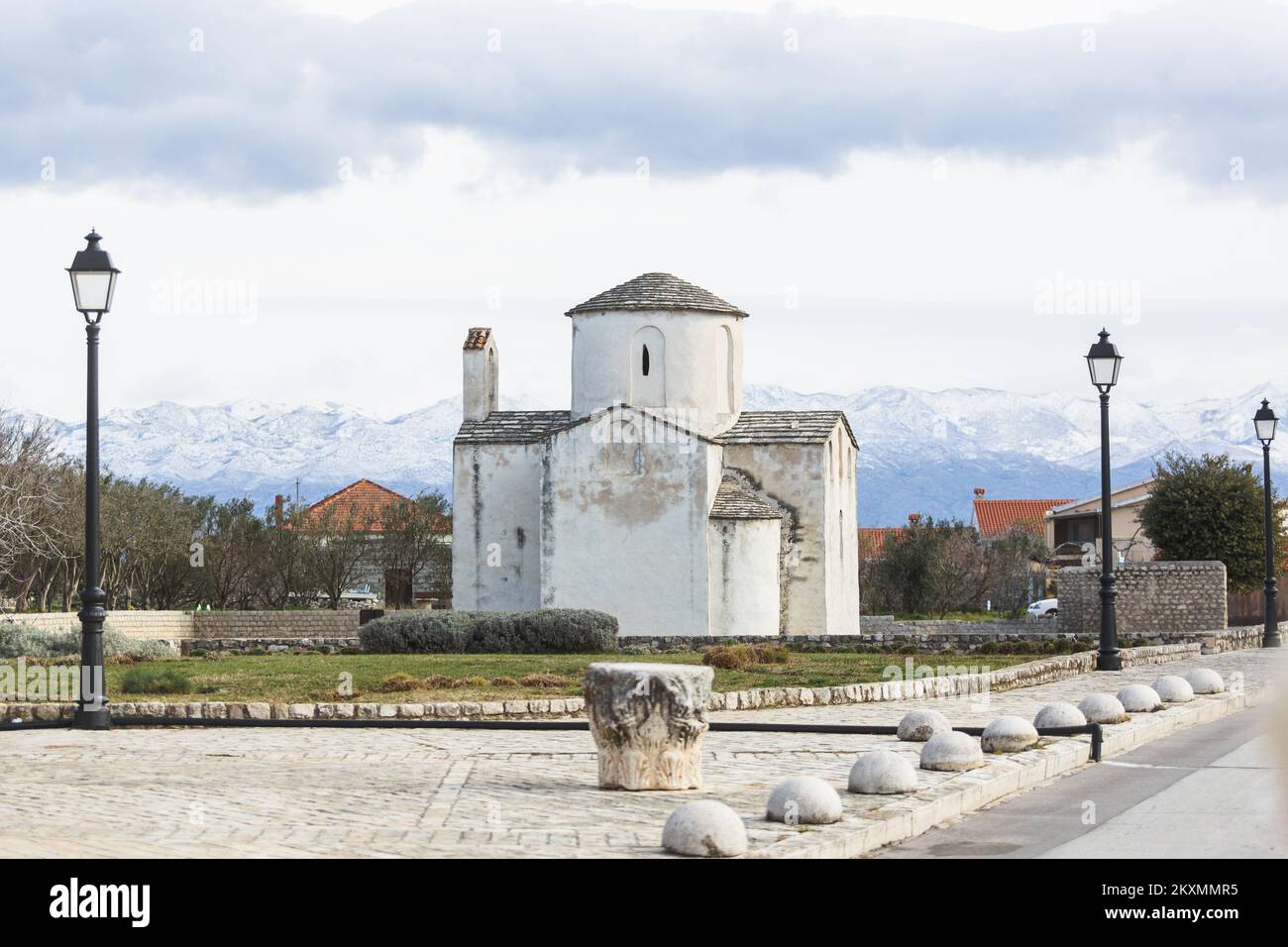 The pictures show the foot of the monument to St. Gregory of Nin with a ...