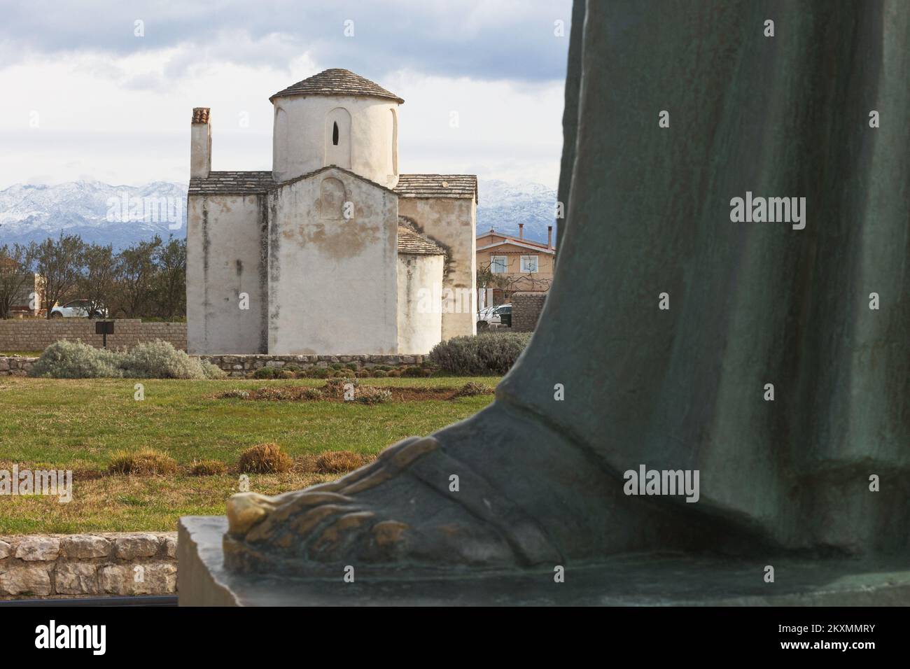 The pictures show the foot of the monument to St. Gregory of Nin with a ...