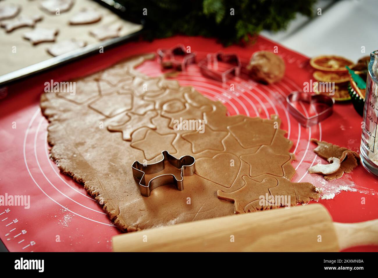 raw rolled dough for ginger cookies with cutter in shape of man ...
