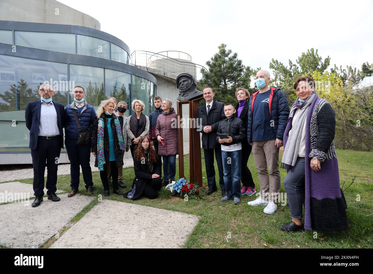 Russian cosmonaut Sergey Ryazansky pose for photo at the monument to ...