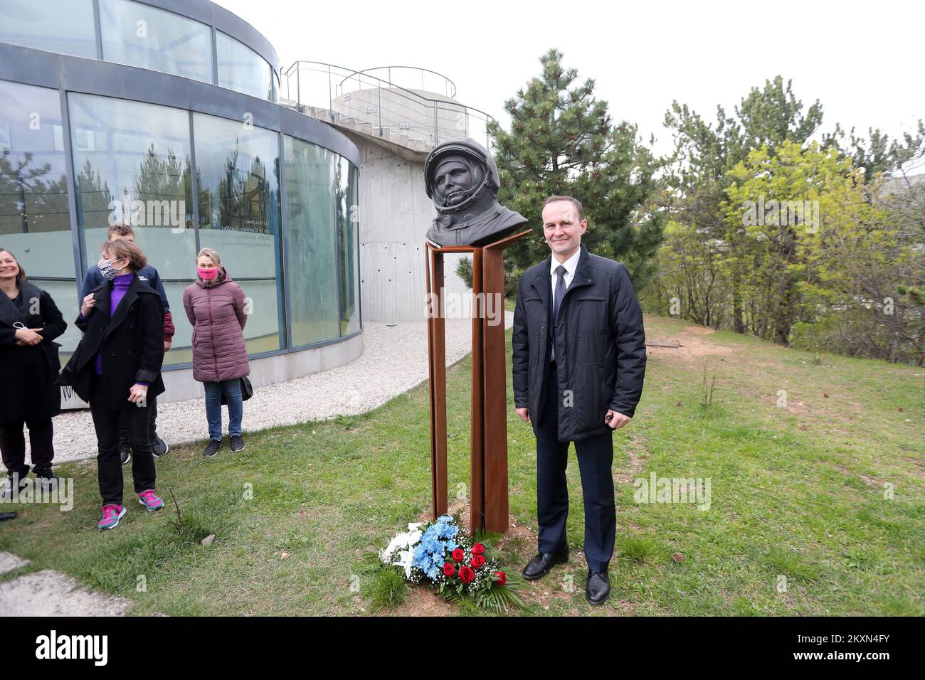 Russian cosmonaut Sergey Ryazansky pose for photo at the monument to ...