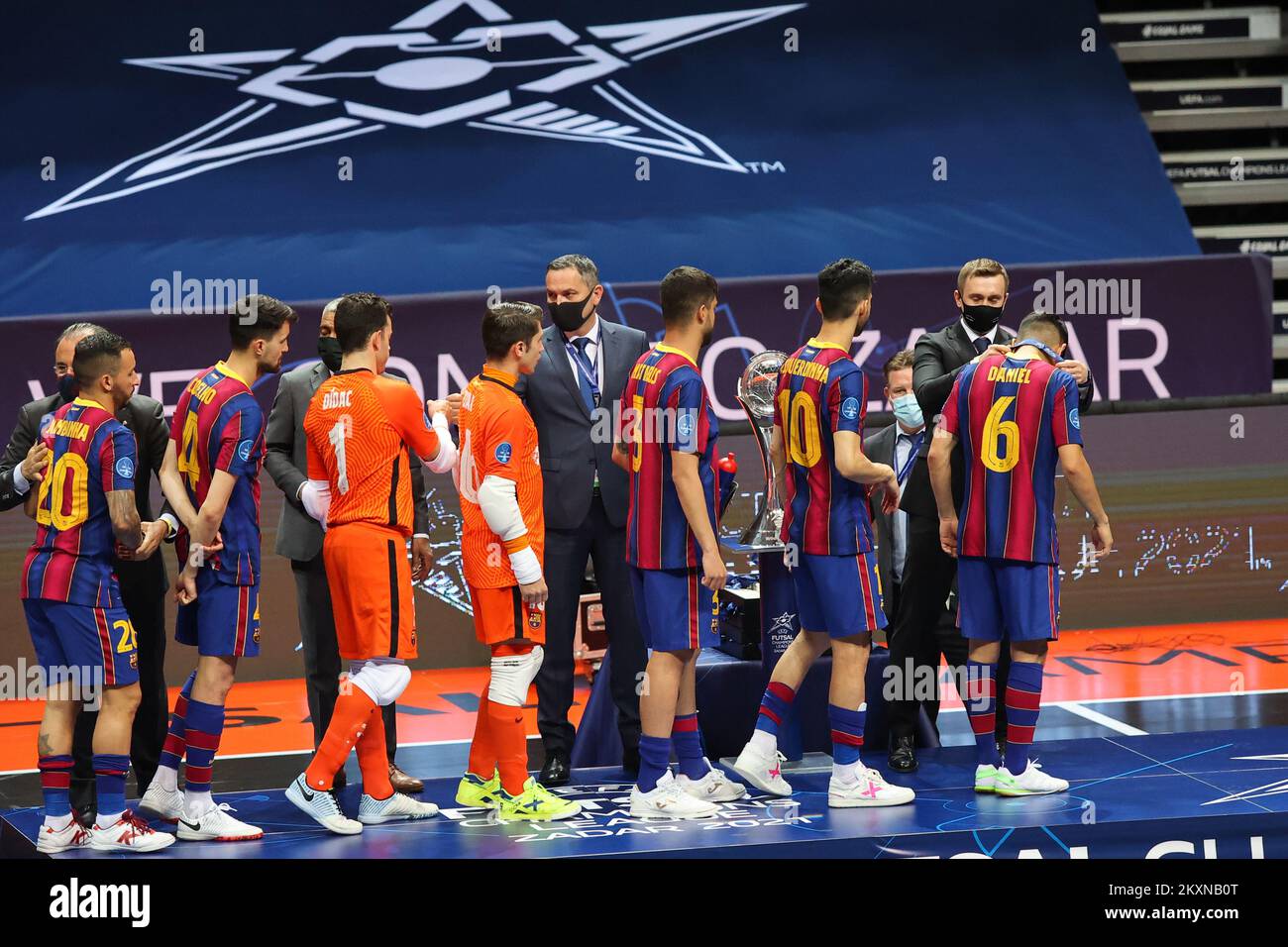 Barca players are presented with runners up medals after UEFA Futsal ...
