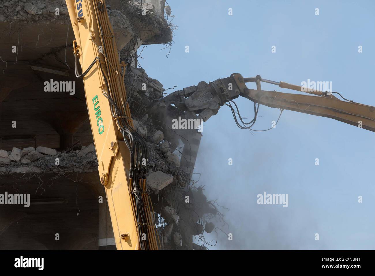 Demolition crane is pictured dismantling old warehouse at city dock in ...