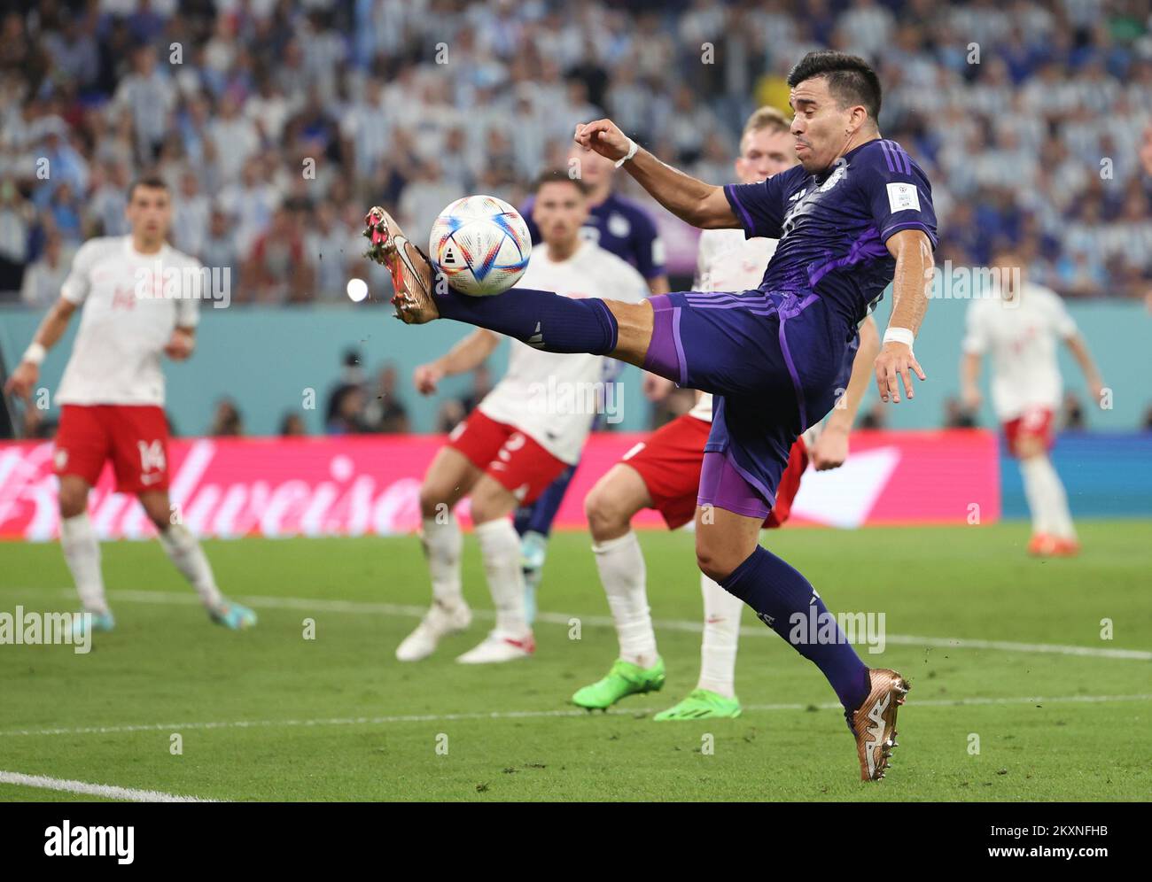 Doha, Qatar. 30th Nov, 2022. Marcos Acuna of Argentina kicks the ball ...
