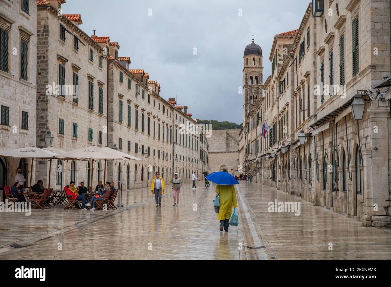Citizens and tourists seen with umbrellas on Stradun in Dubrovnik ...