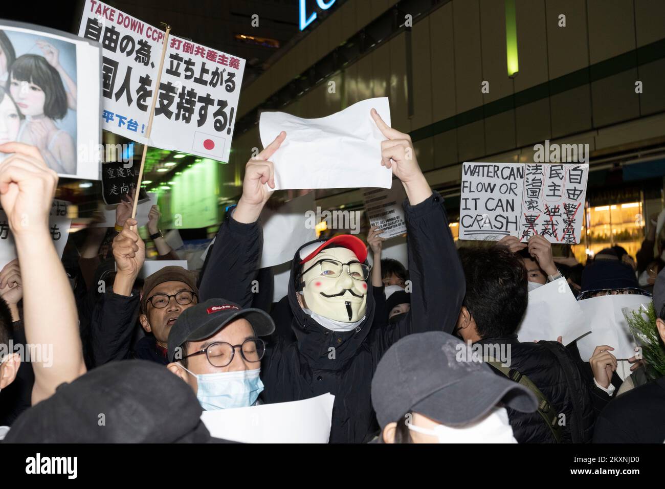 Tokyo, Japan. 30th Nov, 2022. Protesters with Guy Fawkes masks from ...