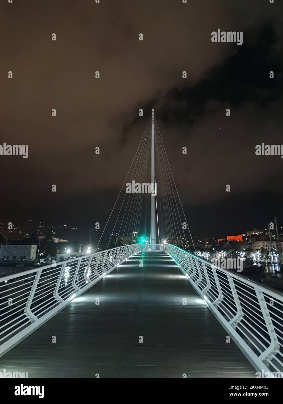 night bridge at port over water with lights reflection and beautiful ...