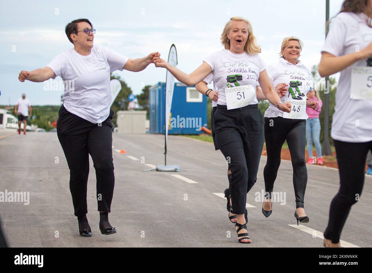 Traditional high heels race was held on the road in Vodnjan, Croatia on ...