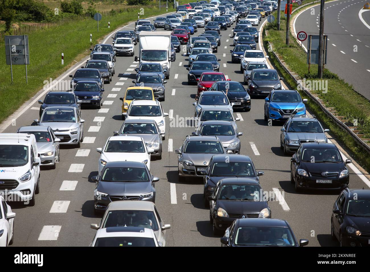 Cars line up in long tracffic jam to enter the A1 Croatia highway at ...