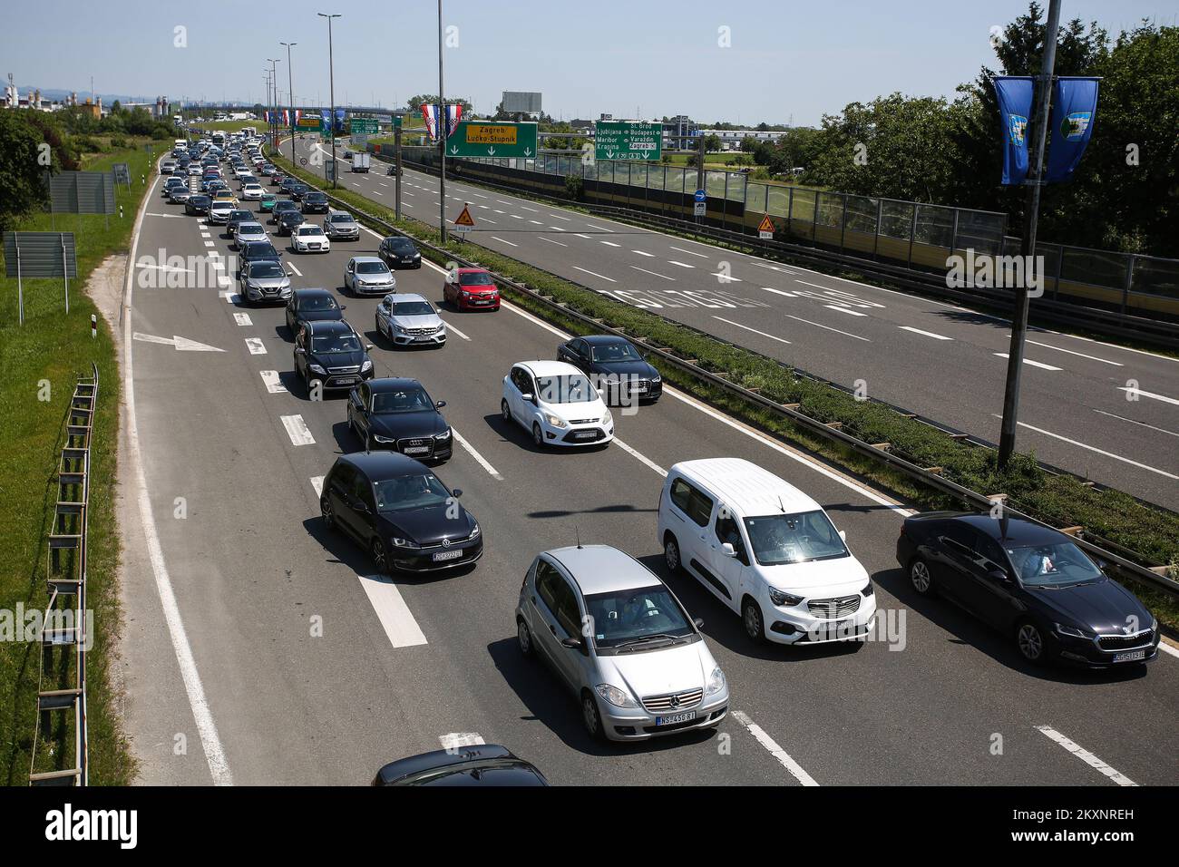 Cars line up in long tracffic jam to enter the A1 Croatia highway at ...