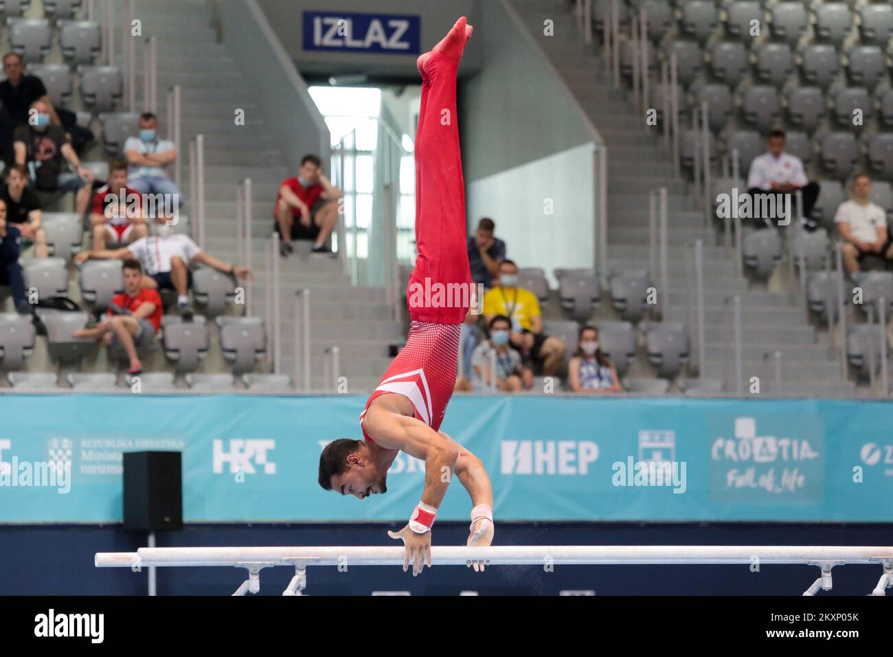 Gymnast Arican Ferhat of Turkey competes in the men's Parallel Bars ...