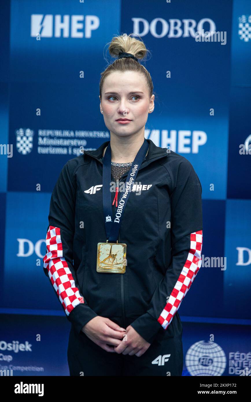 Gymnast Ana Djerek of Croatia pose at a victory ceremony for the Women ...