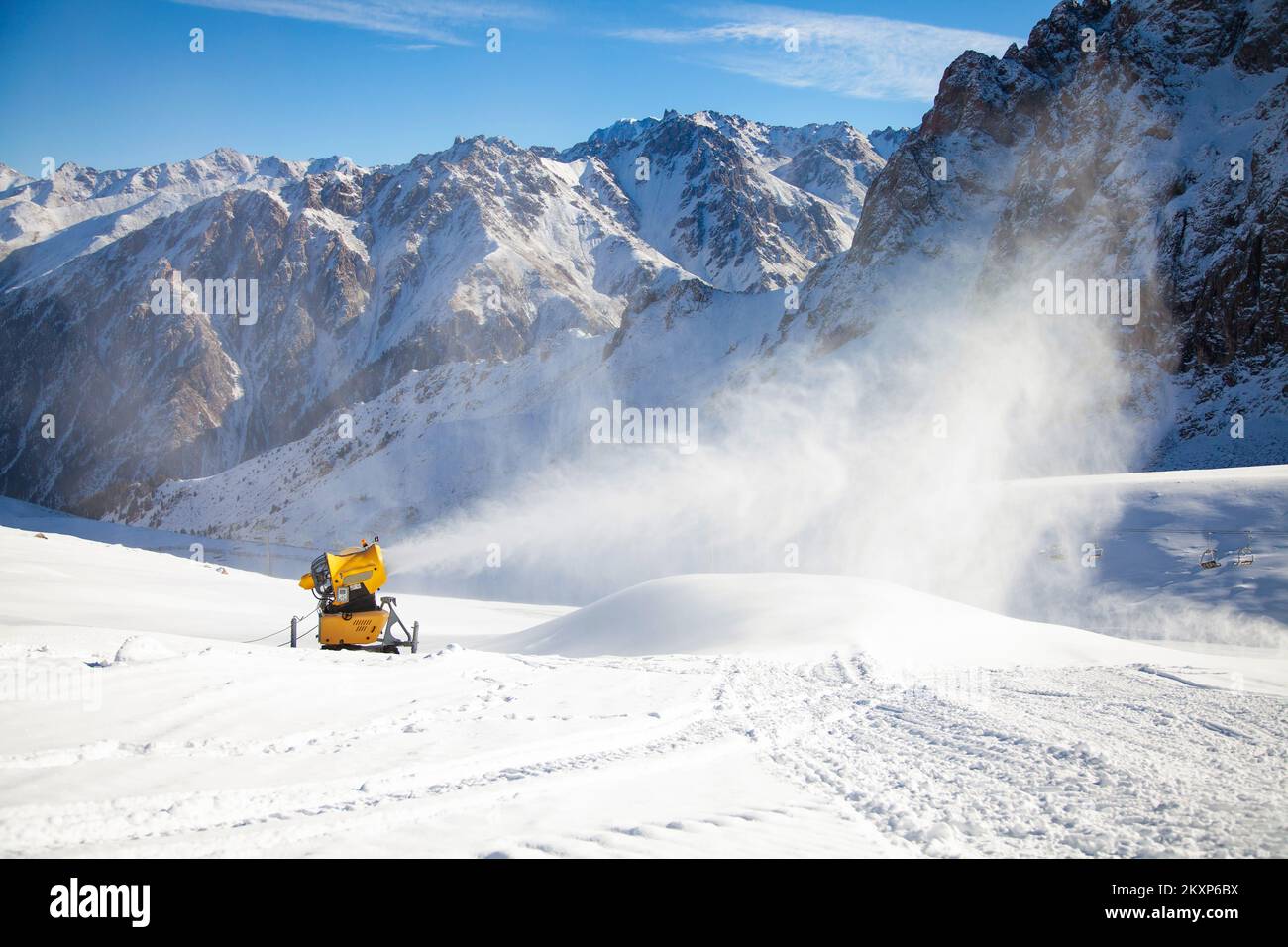 Snow cannon in action at mountain ski resort Stock Photo - Alamy
