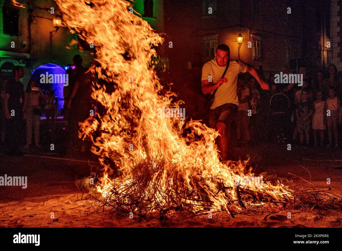 Children jumping through bonfire in Vodnjan, Croatia on 23. June 2021 ...