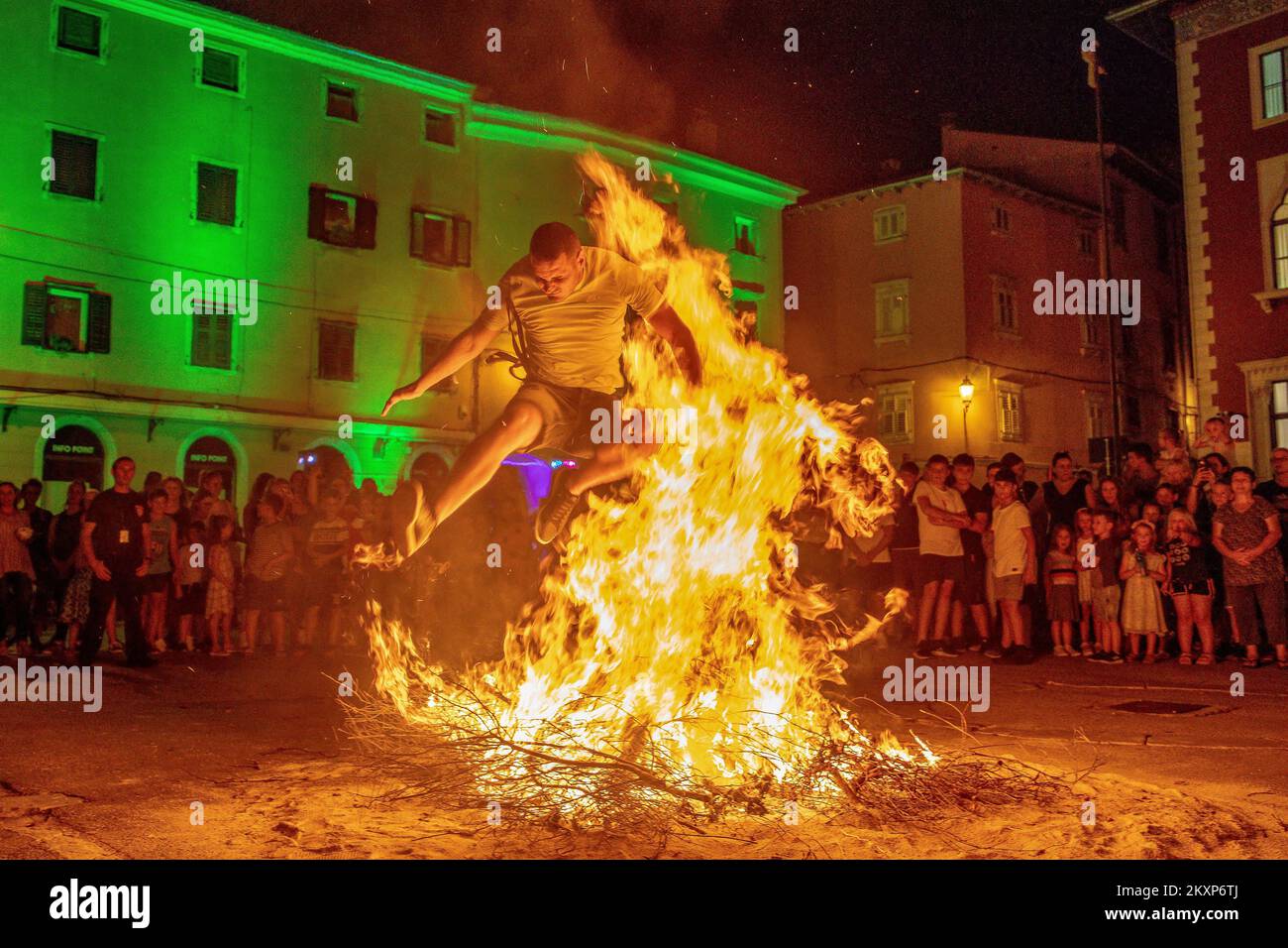 Children jumping through bonfire in Vodnjan, Croatia on 23. June 2021 ...