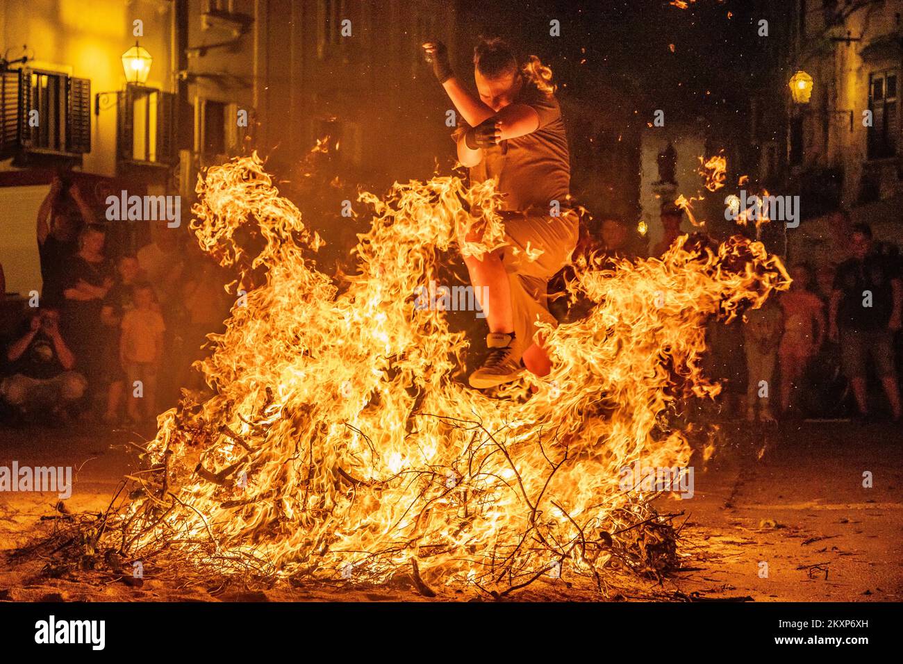 Children jumping through bonfire in Vodnjan, Croatia on 23. June 2021 ...