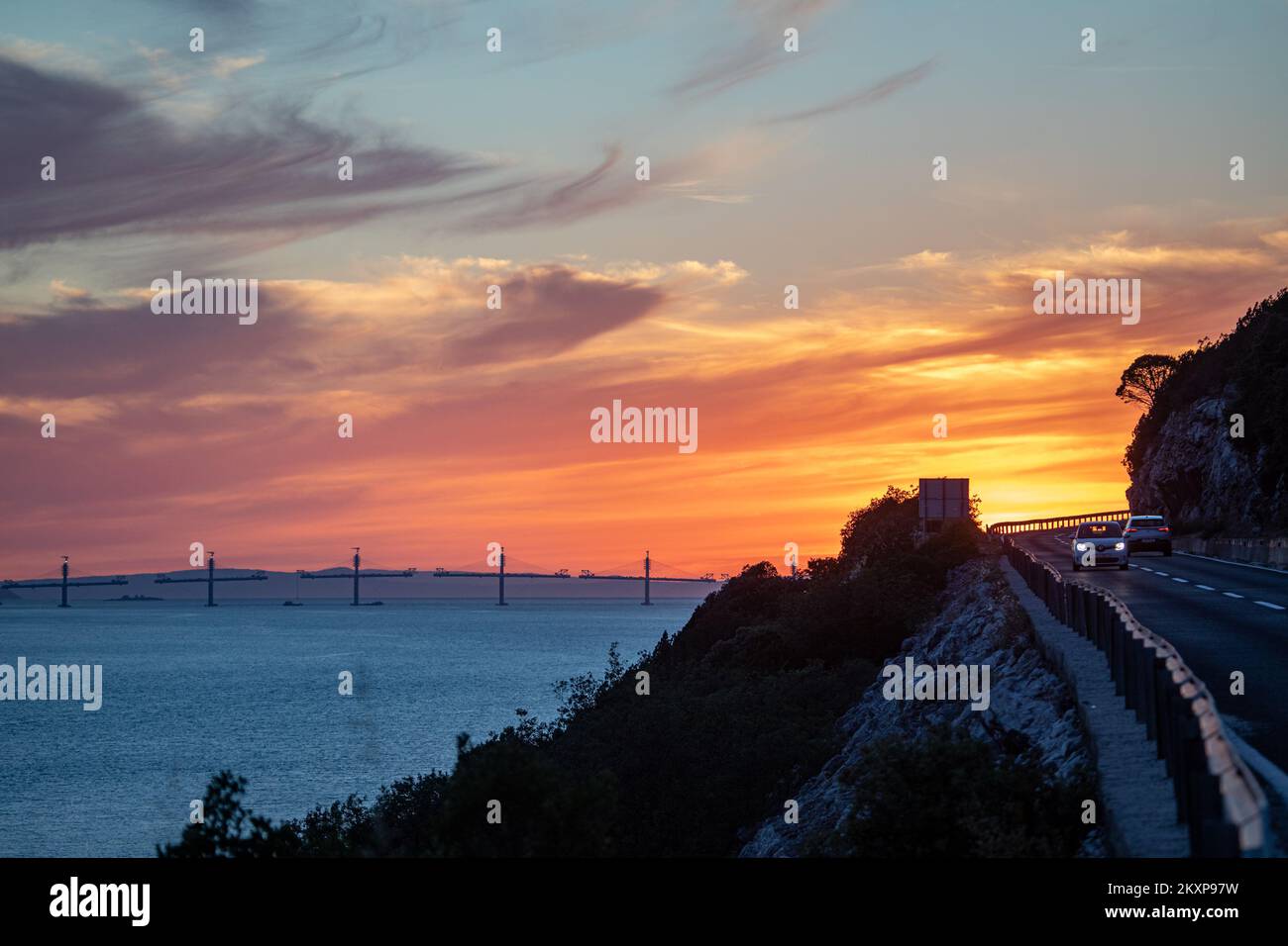 View of the sunset over the construction site of the Peljesac Bridge ...