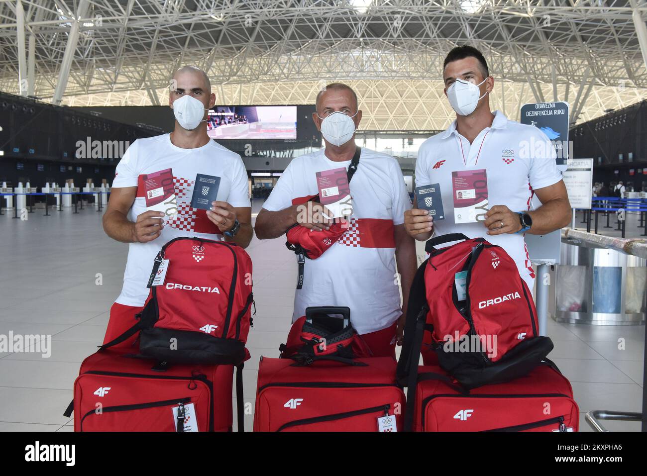 Croatian rowers Martin and Valent Sinkovic with coach Nikola Bralic ...