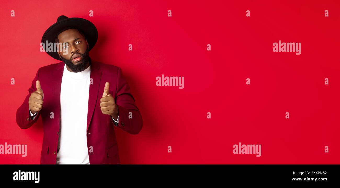 Impressed Black man saying good job, cheer up with thumbs-up, praise ...